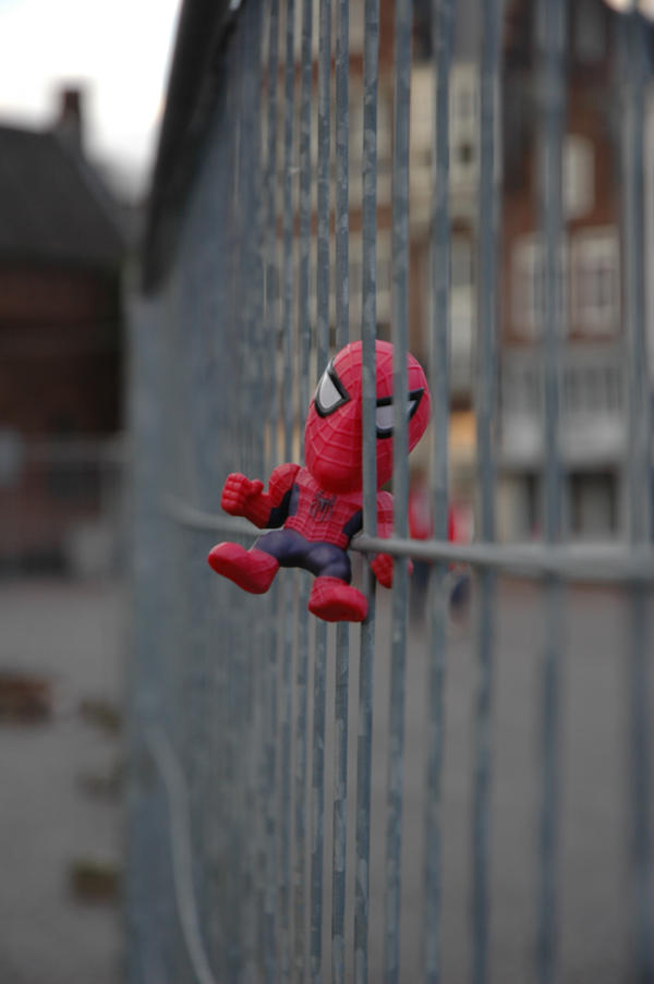 Spiderman trapped on a fence by MOTFG on DeviantArt