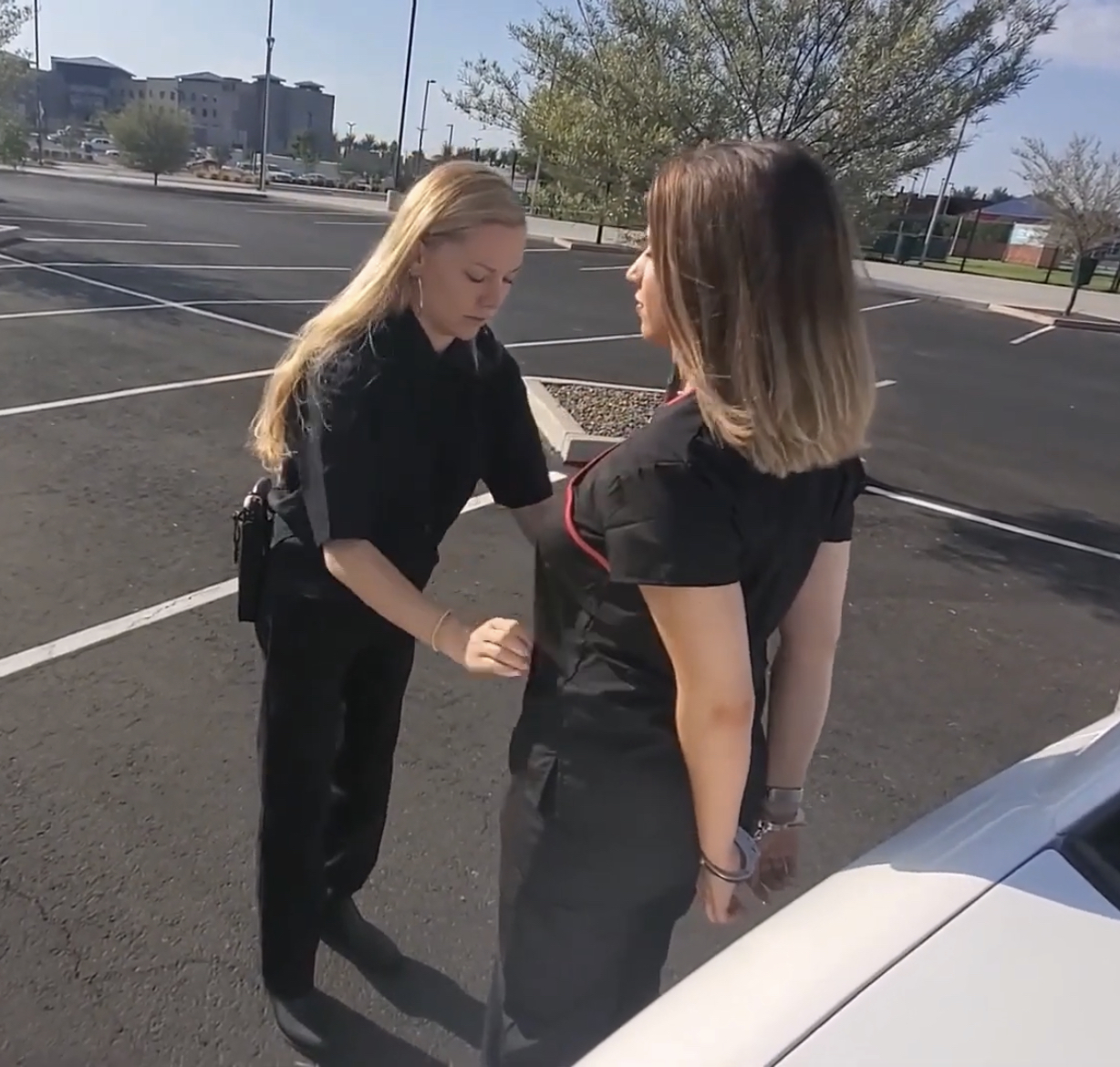 Handcuffed Woman Searched By Female Officer Front By Ashnagopal On