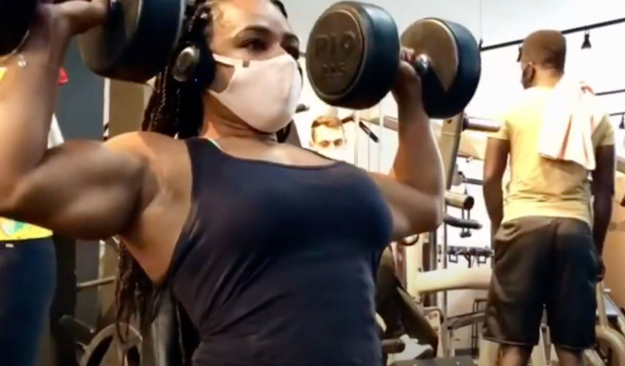 Super Strong Woman Lifts As Weak Man Stands Nearby By Bigelowmax On